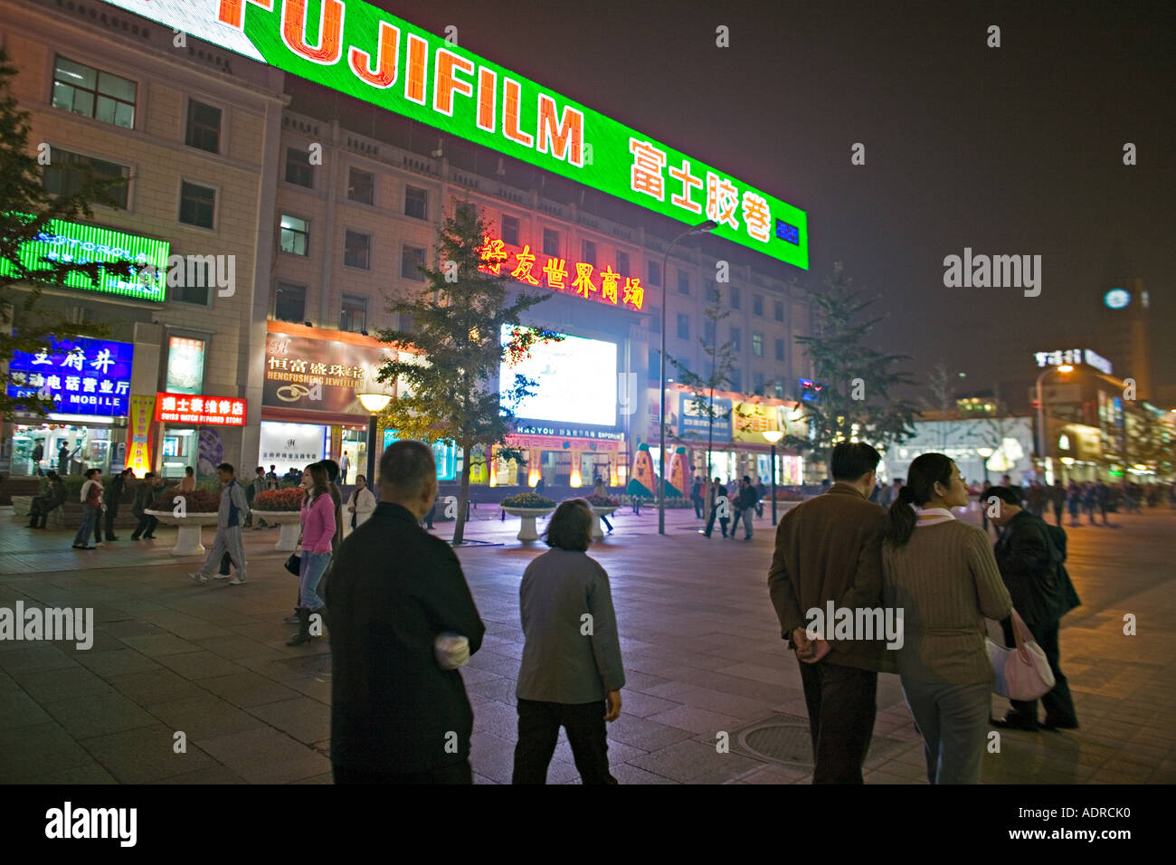 CHINA BEIJING Night scene of crowded shopping street Wangfujing Dajie ...