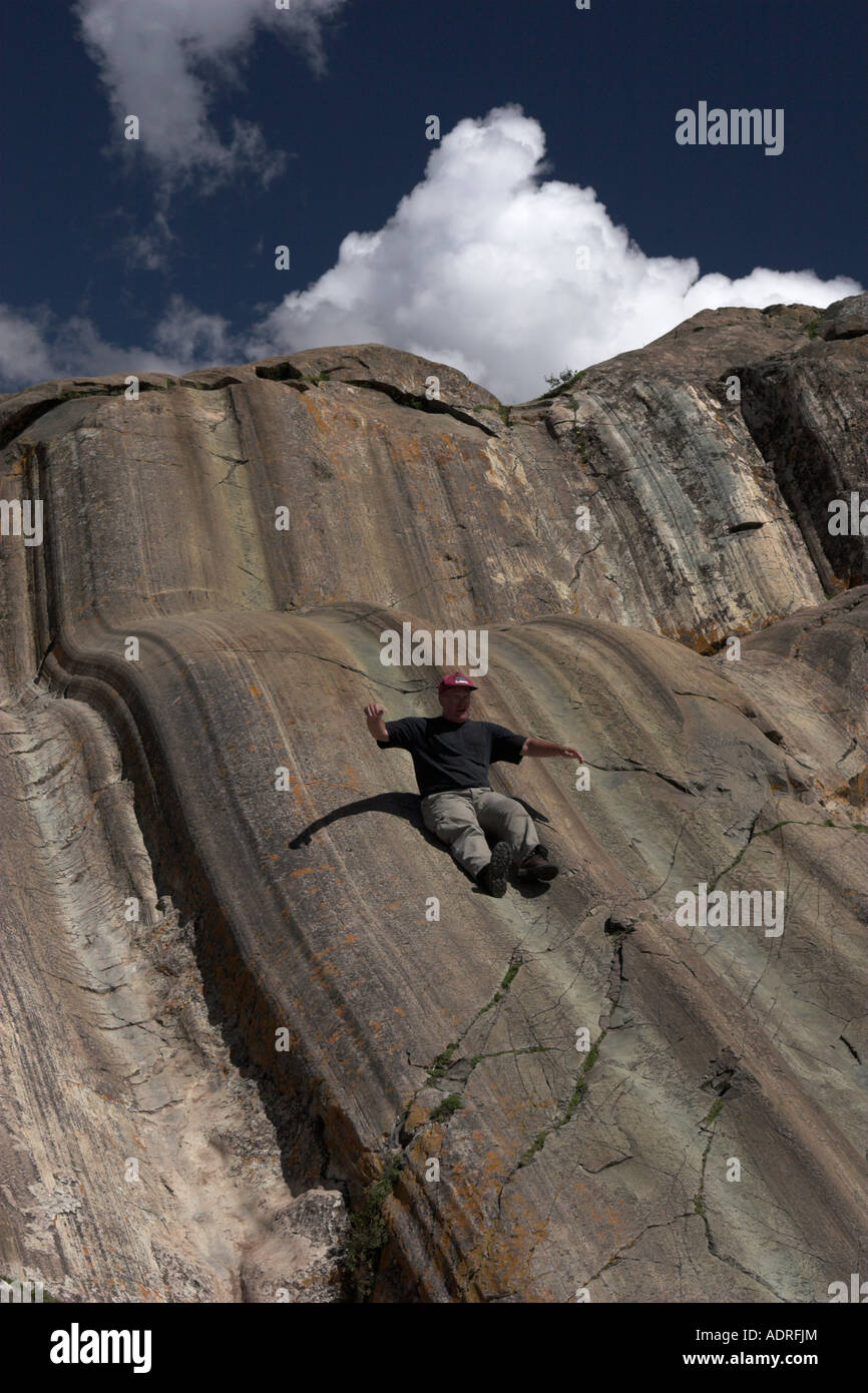 Rodadero Hill, tourist sliding down smooth rock slope, Sacsayhuaman ...