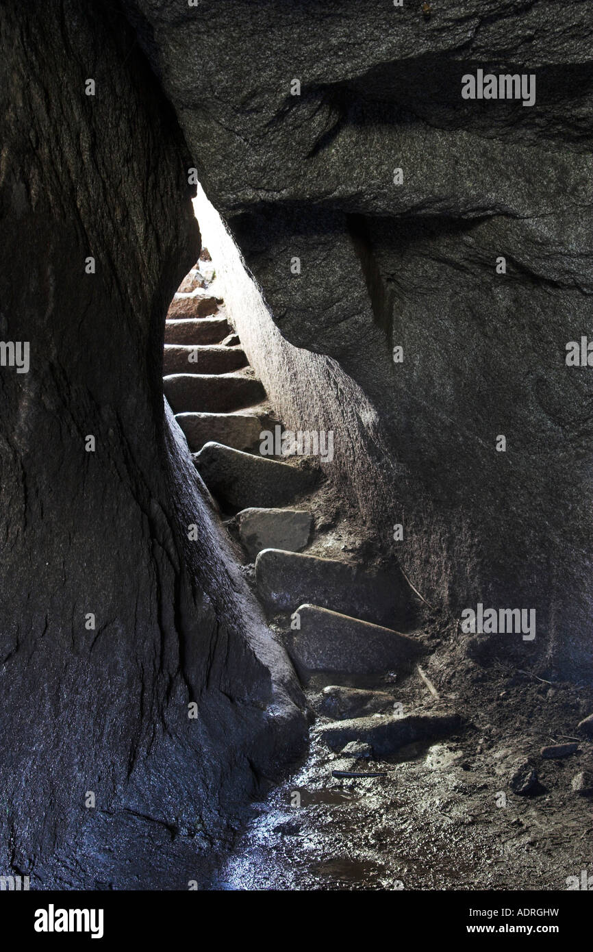 [Huayna Picchu], narrow stone carved Inca steps leading out of small ...