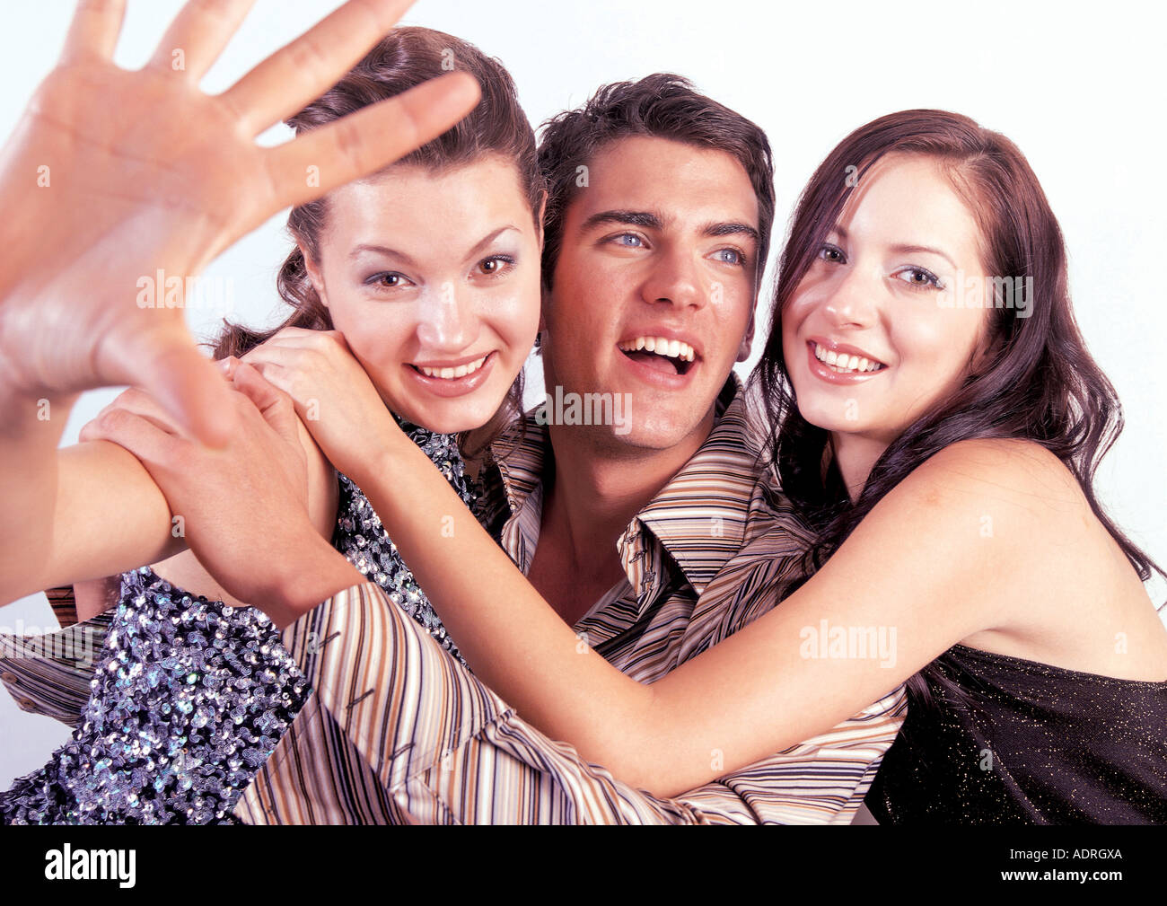 Three young models sitting hi-res stock photography and images - Alamy
