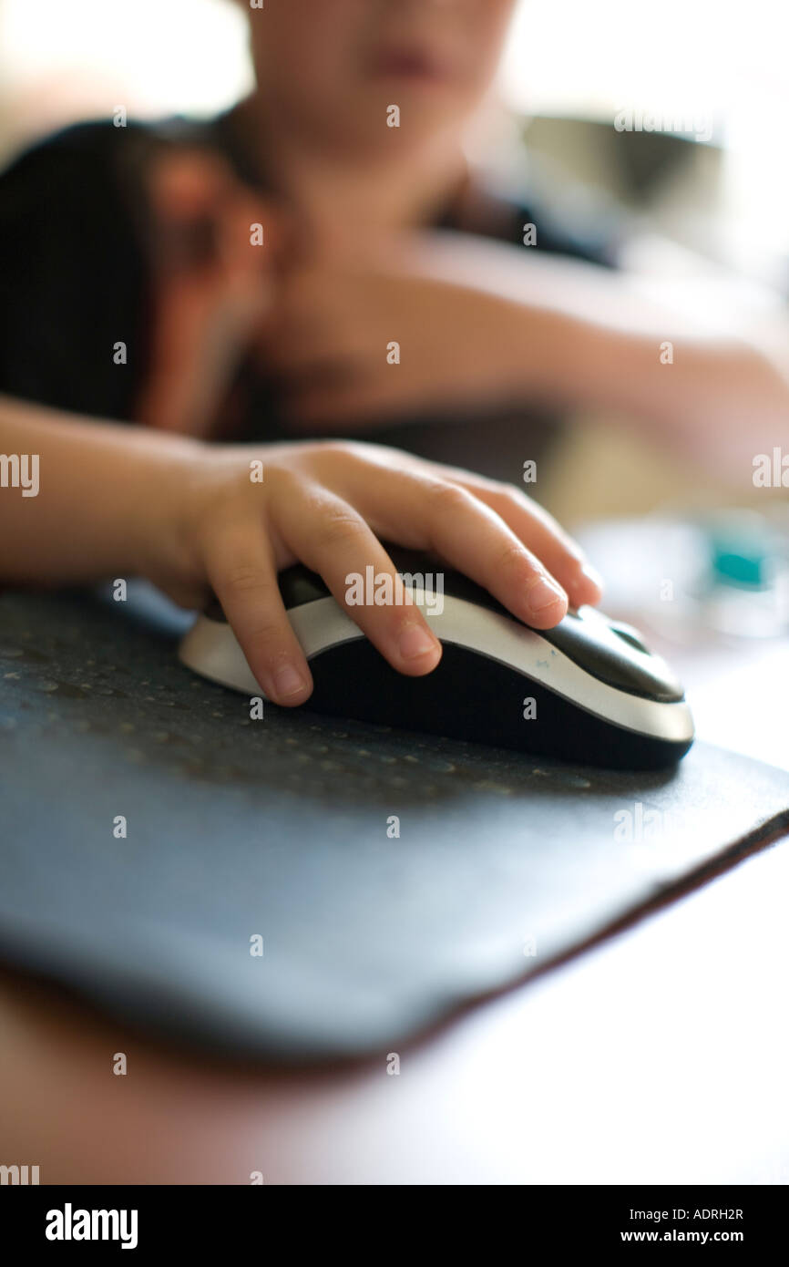 Boy using computer Stock Photo - Alamy