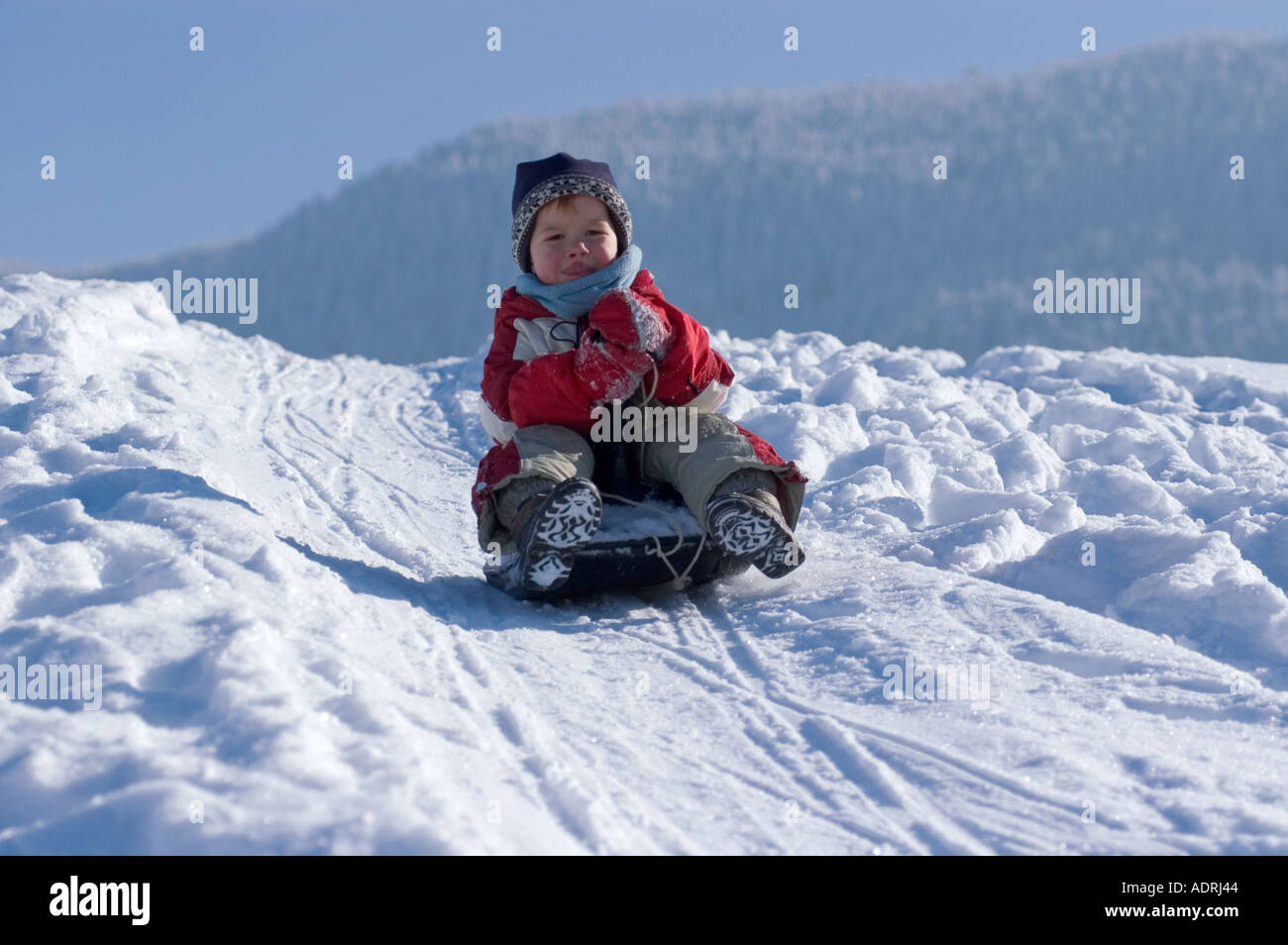 Boy on a sledge hi-res stock photography and images - Alamy