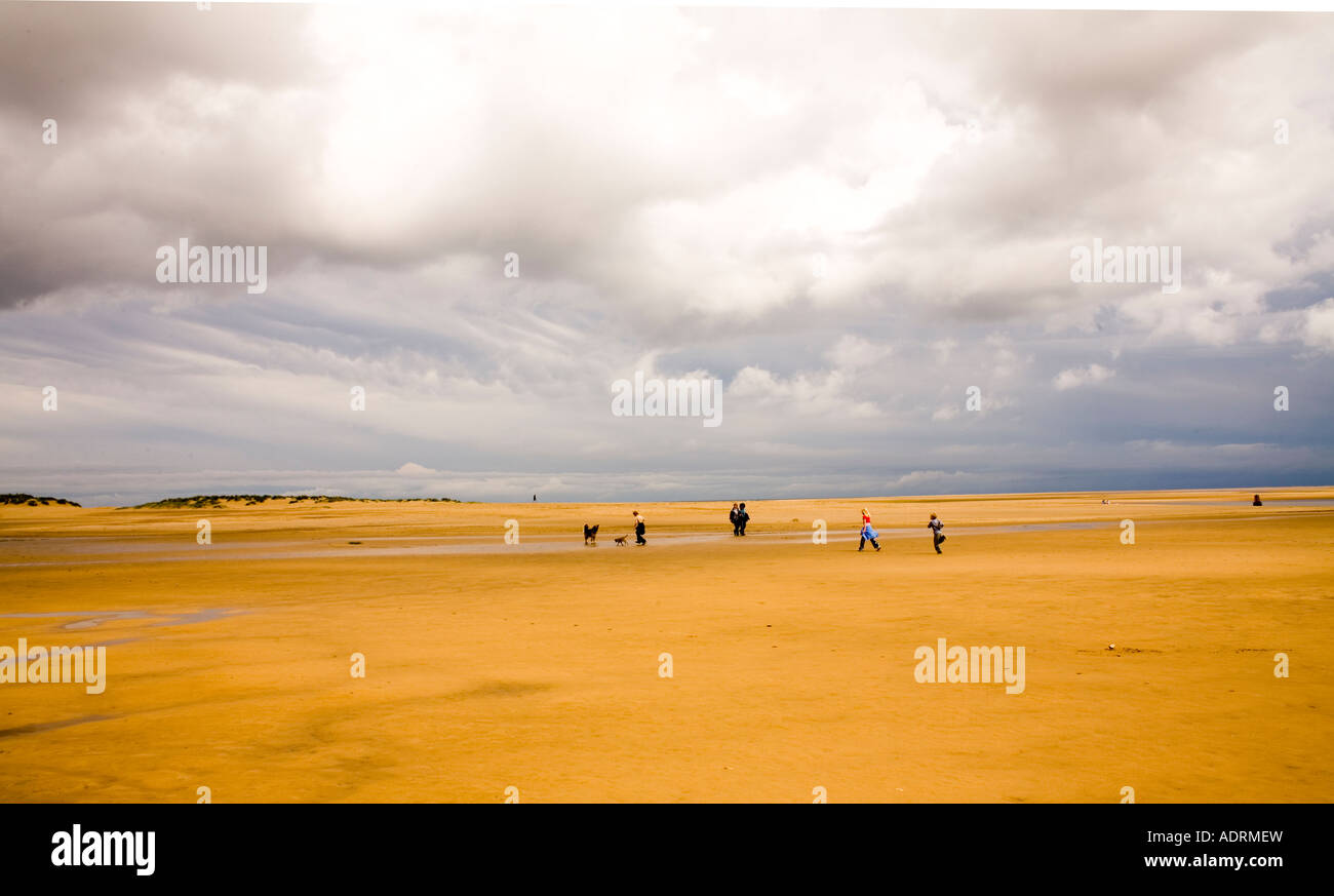 distant figures on beach scenic scenery Stock Photo - Alamy