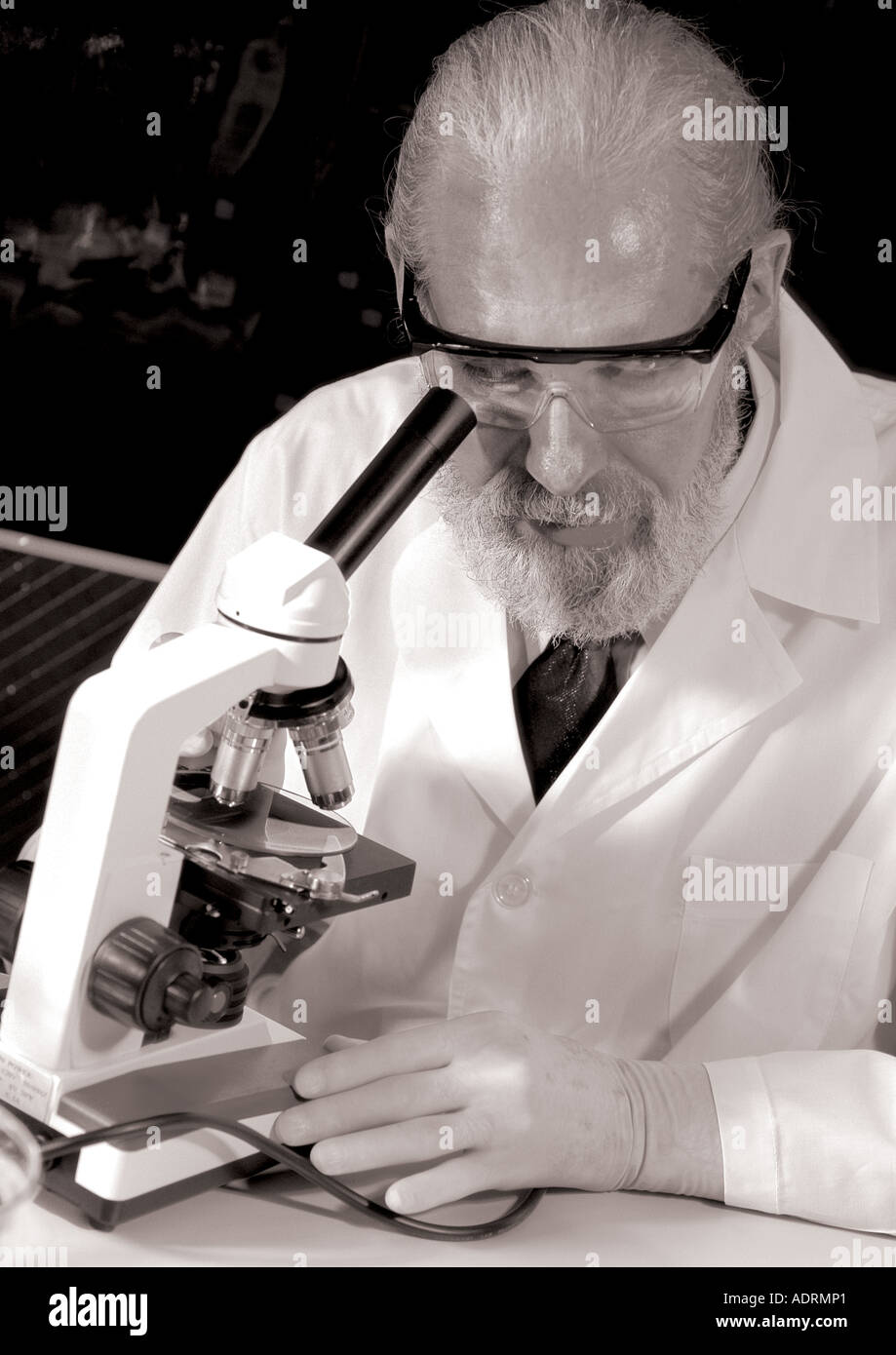 Black man looking through microscope hi-res stock photography and ...
