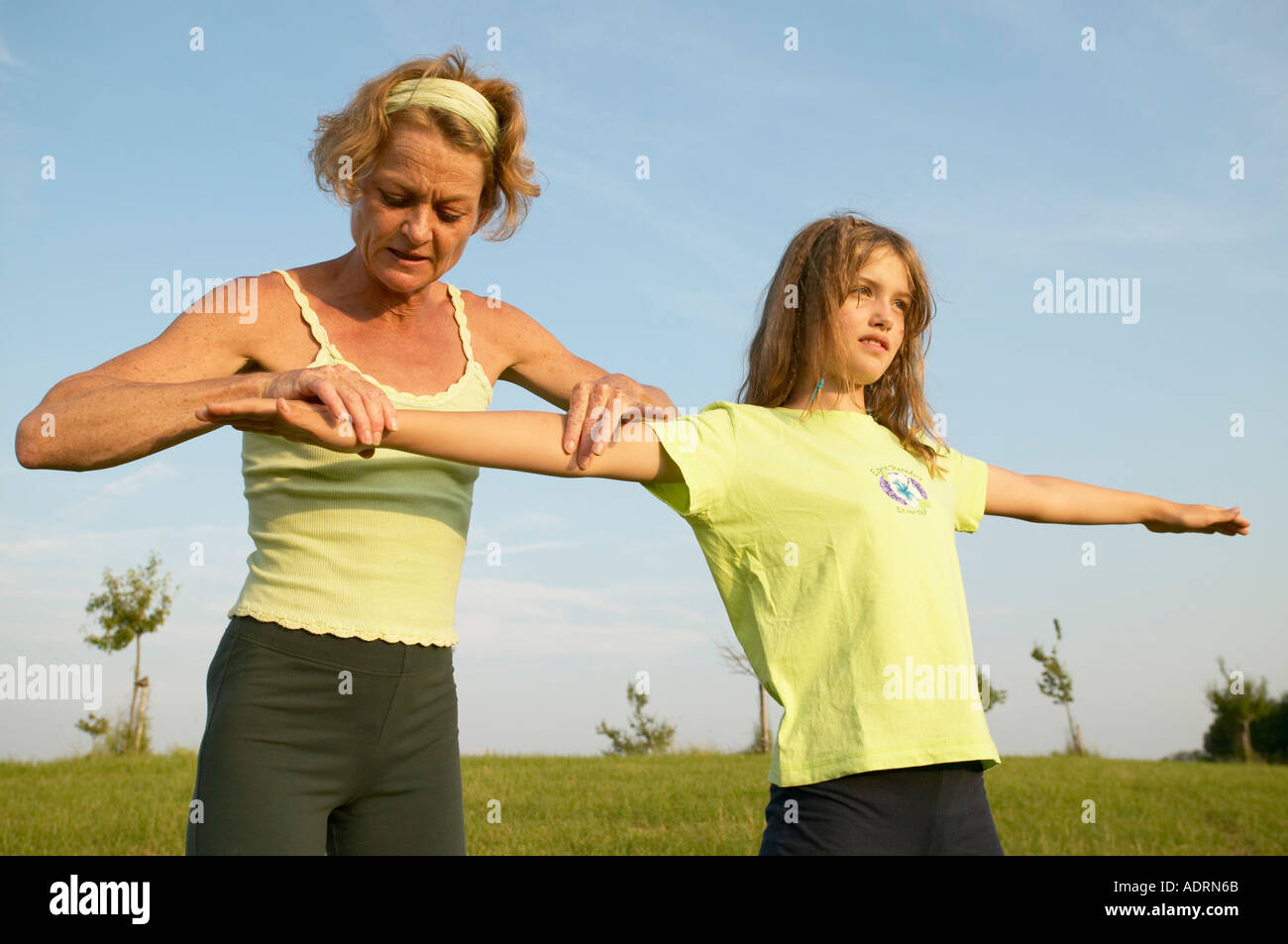 Concentrated girl practicing gymnastics stretching hi-res stock ...