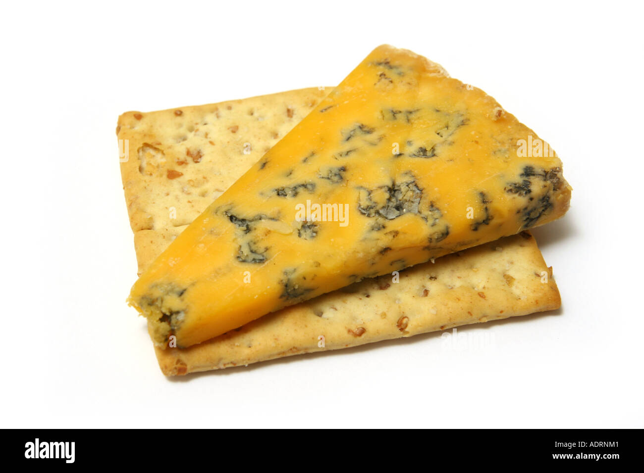 Red stilton cheese on a wafer biscuit isolated on a white studio ...