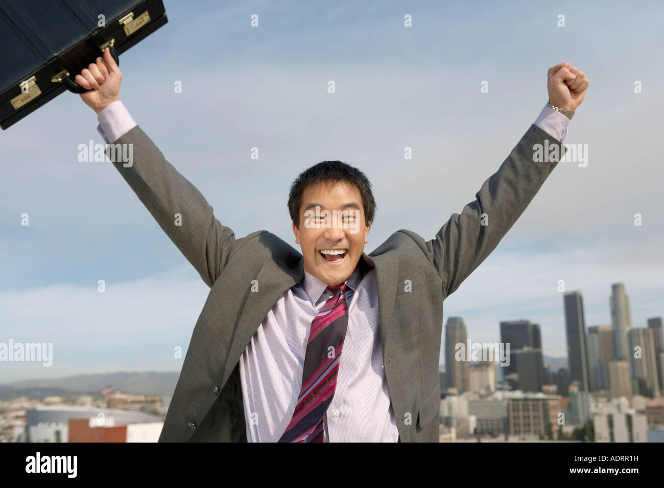 Business man cheering in city Stock Photo - Alamy