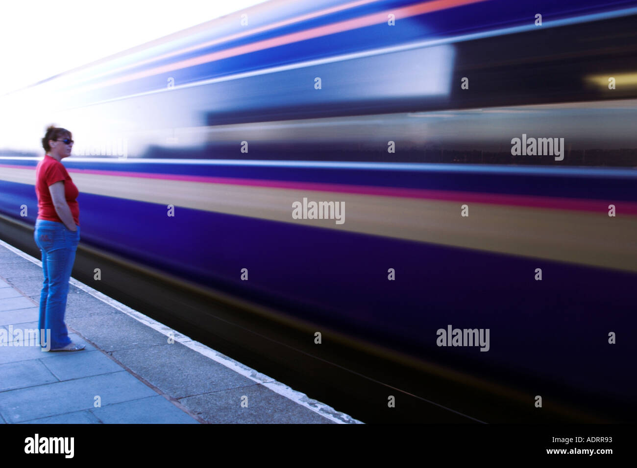 High speed train through station Stock Photo - Alamy