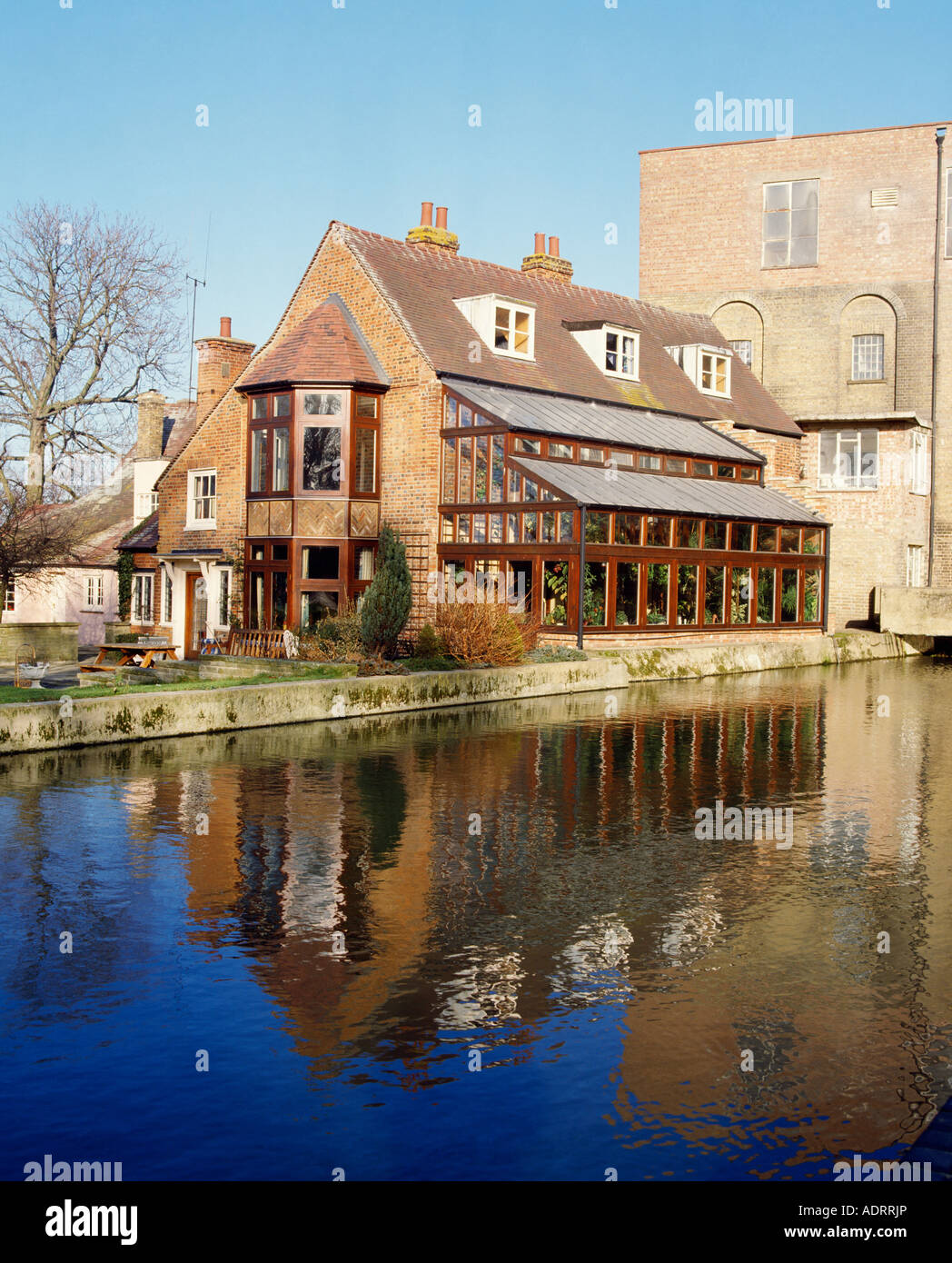 Traditional house with large two storey glass conservatory facing the ...