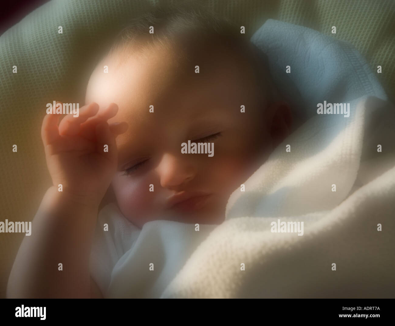 Sleeping baby with hand raised Stock Photo - Alamy