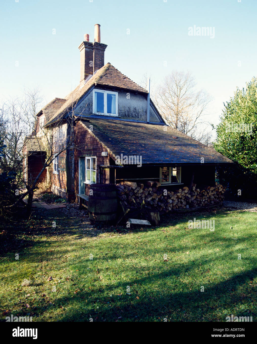 Side view of Victorian country cottage with wooden lean to shed Stock ...