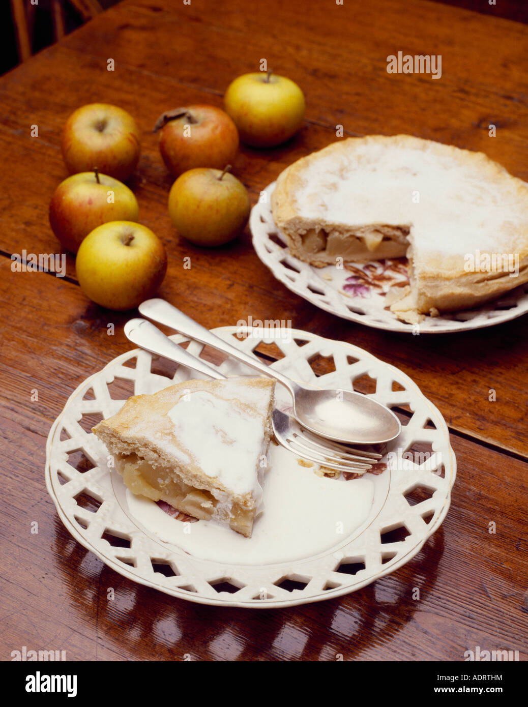 Close up of apple pie and slice of apple pie on plate Stock Photo - Alamy