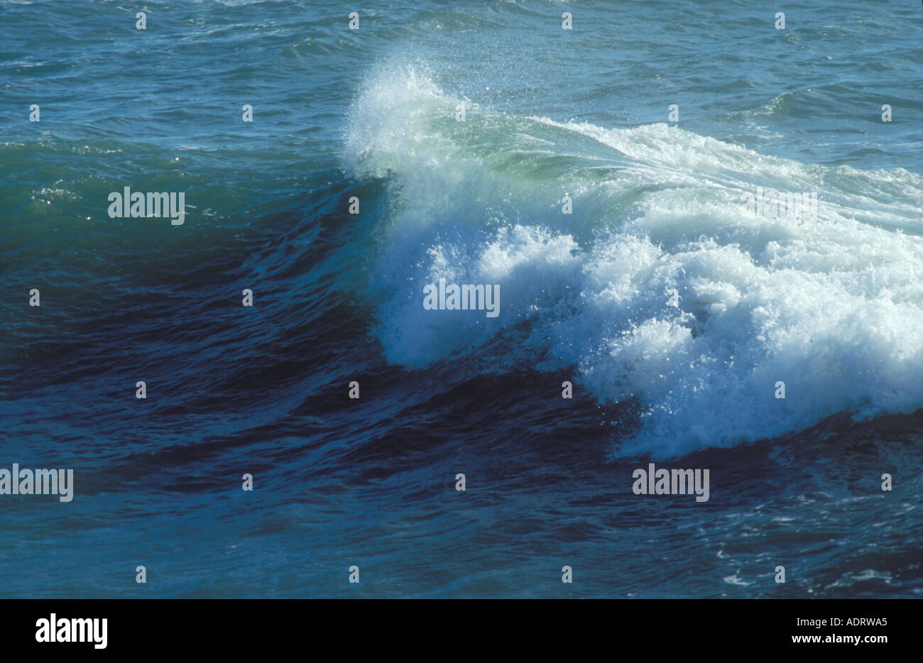 A wave breaking in deep water Stock Photo - Alamy