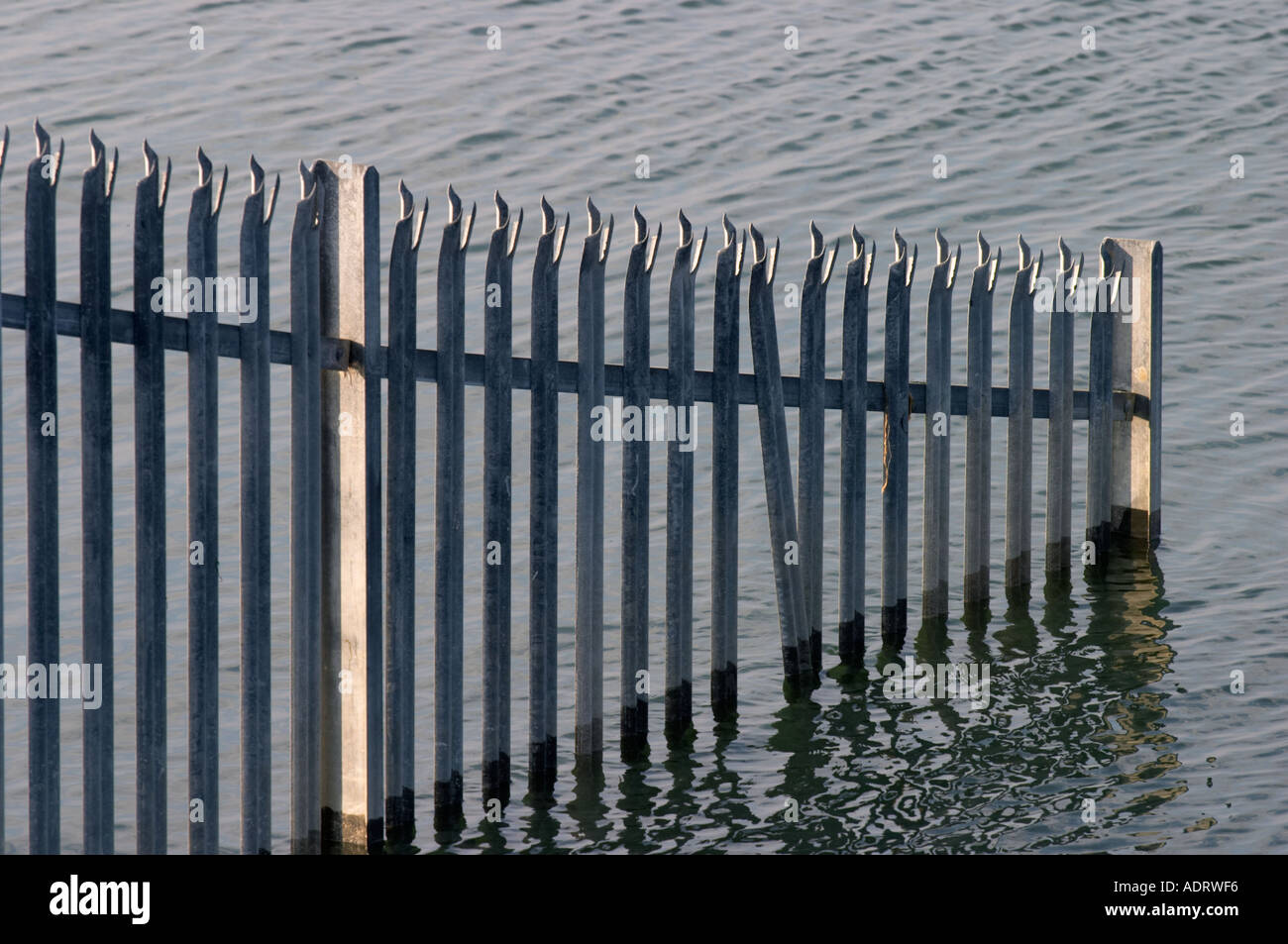 Metal railing going into the sea Stock Photo - Alamy