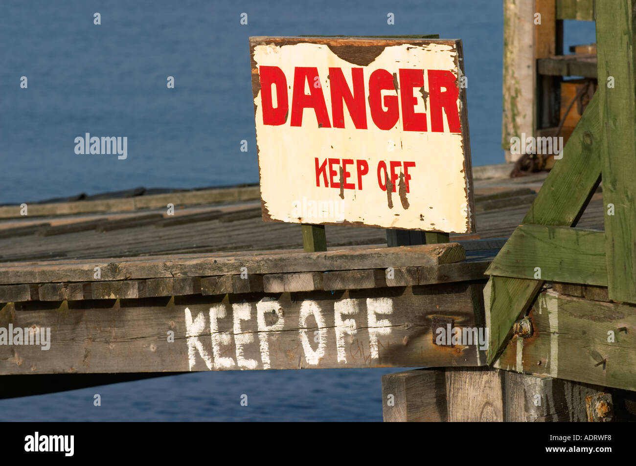 Danger sign on jetty at Southend on Sea Essex England Stock Photo - Alamy