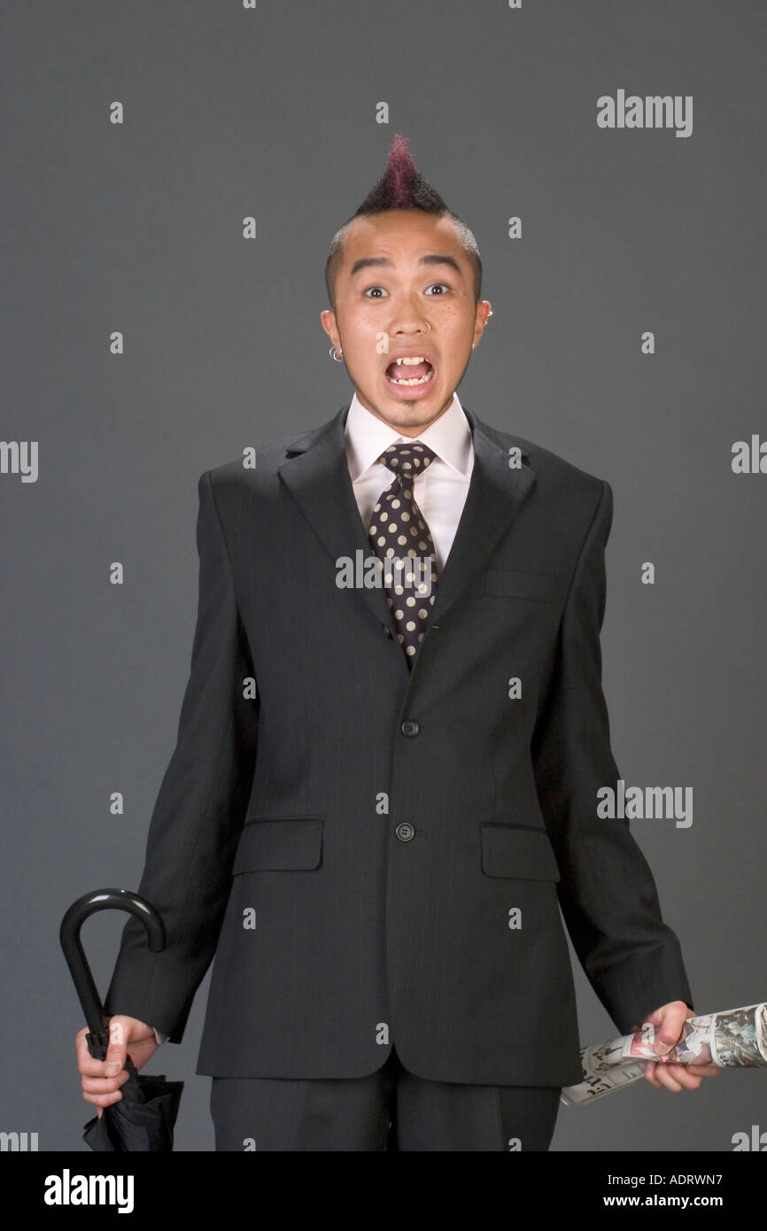 Asian Punk businessman in suit with Red mohawk side joyous celebrating ...