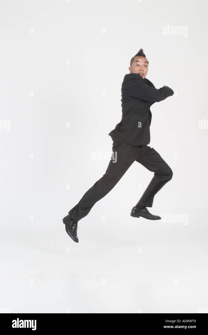 Executive in running pose hi-res stock photography and images - Alamy