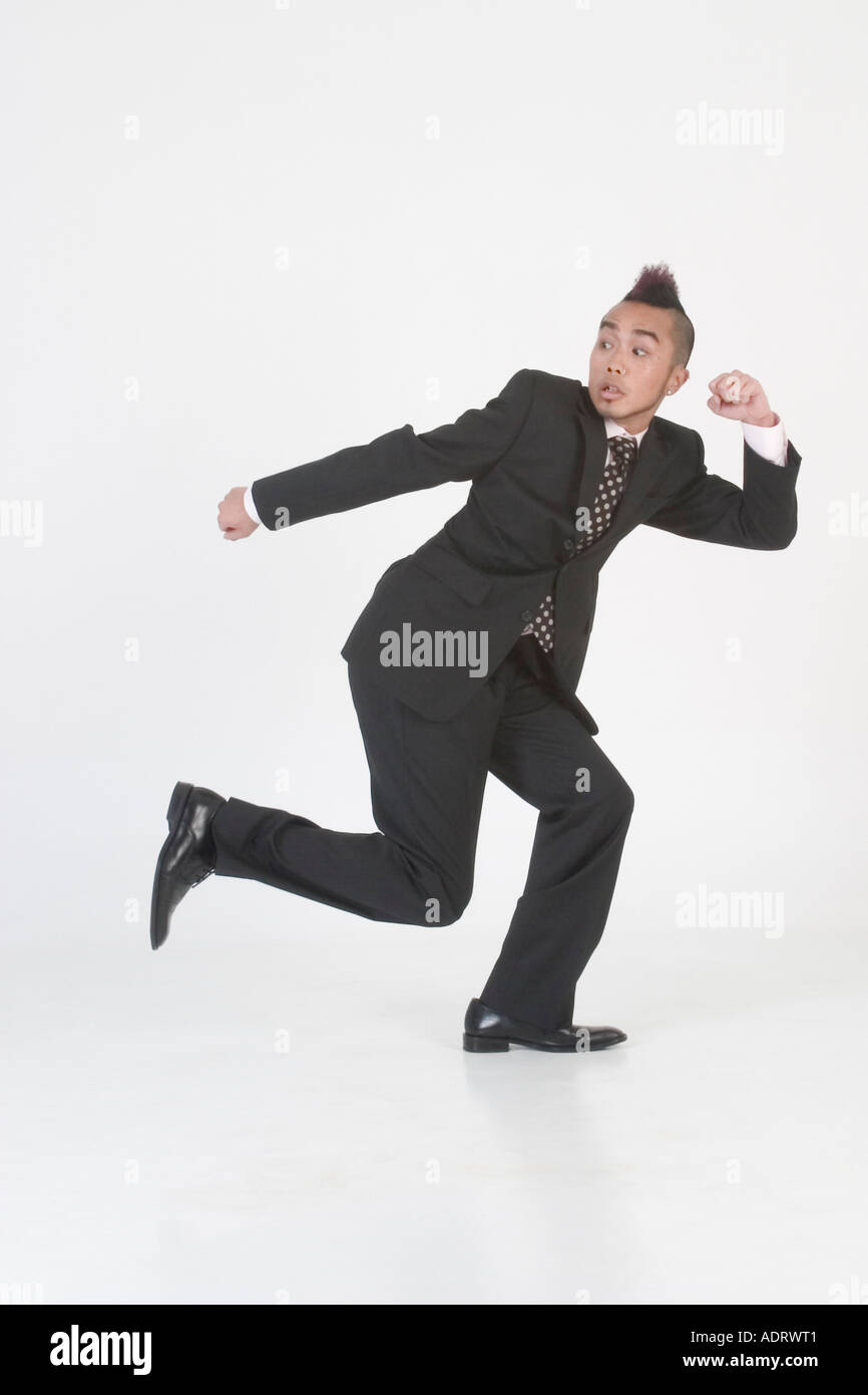 Asian Punk in businessman suit cool calm and collected with Mohawk ...