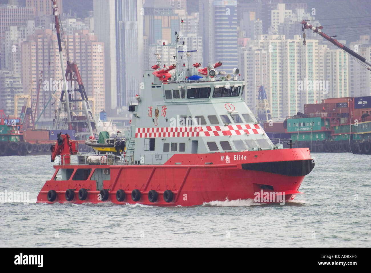 Hong Kong Fire Fighting Engine Boat cruising past Container transfer ...