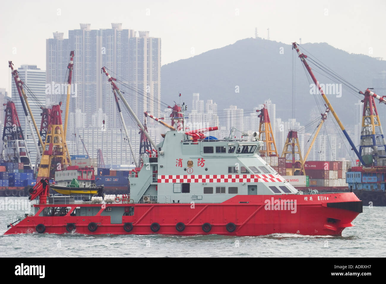 Hong Kong Fire Fighting Engine Boat cruising past Container transfer ...