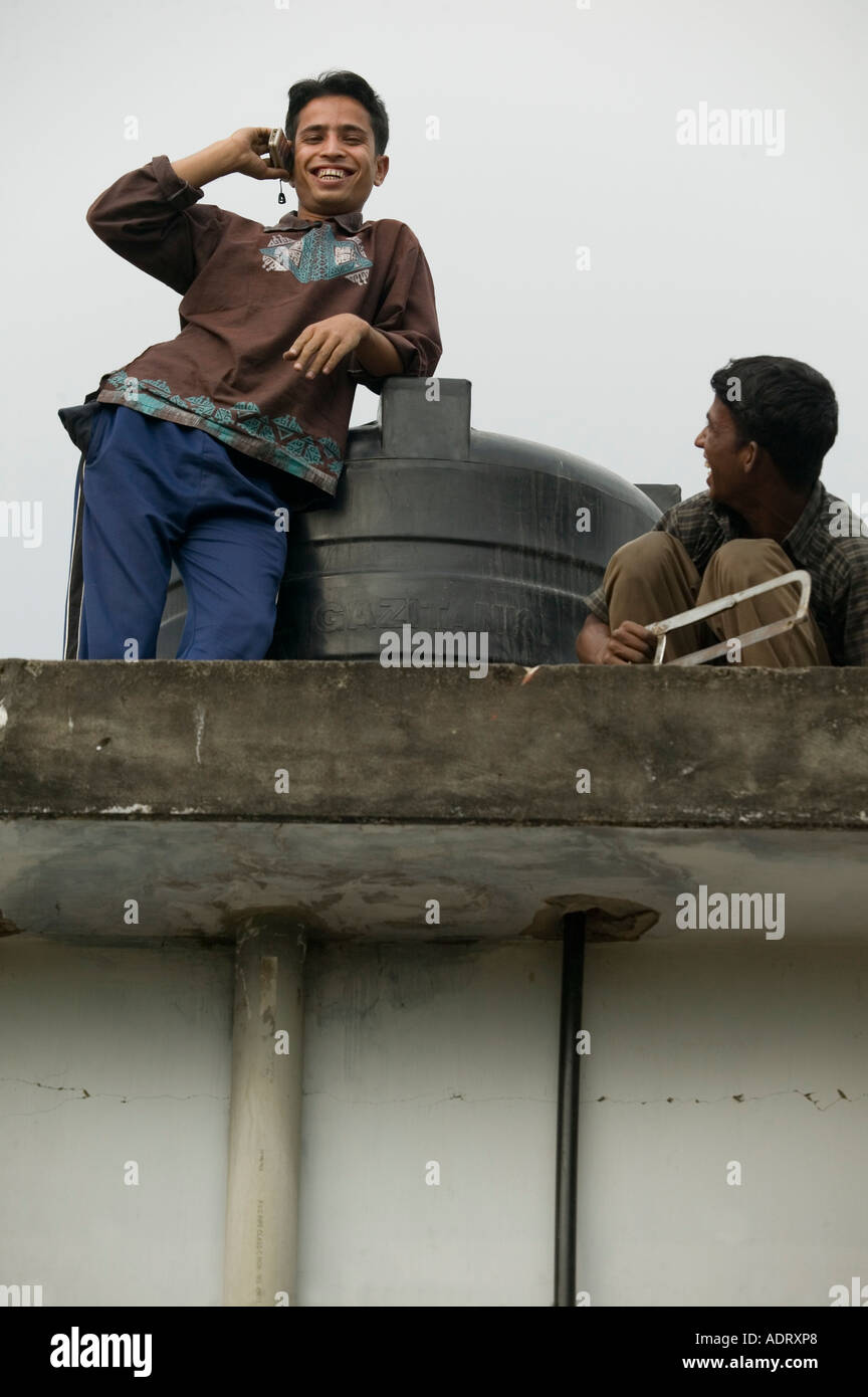 The village plumber using his mobile phone Sylhet Bangladesh Stock ...