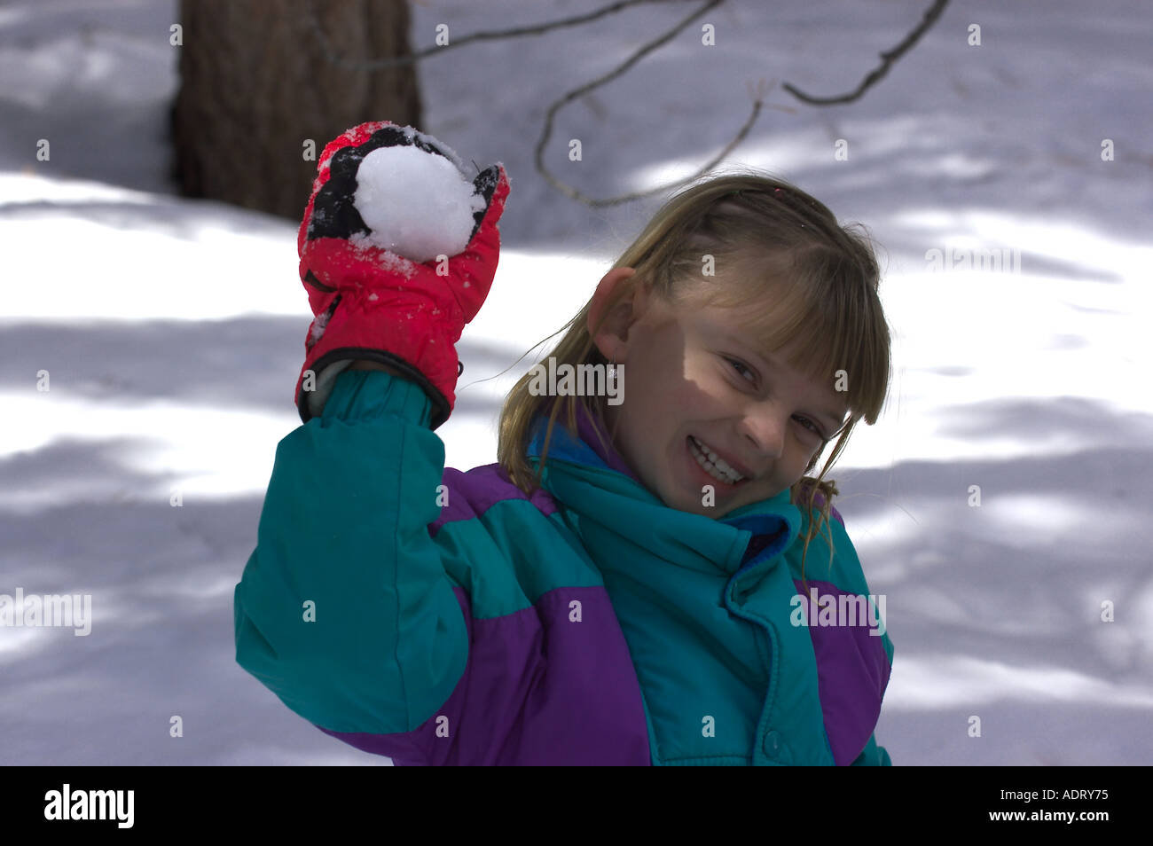 young girl with snowball Stock Photo - Alamy