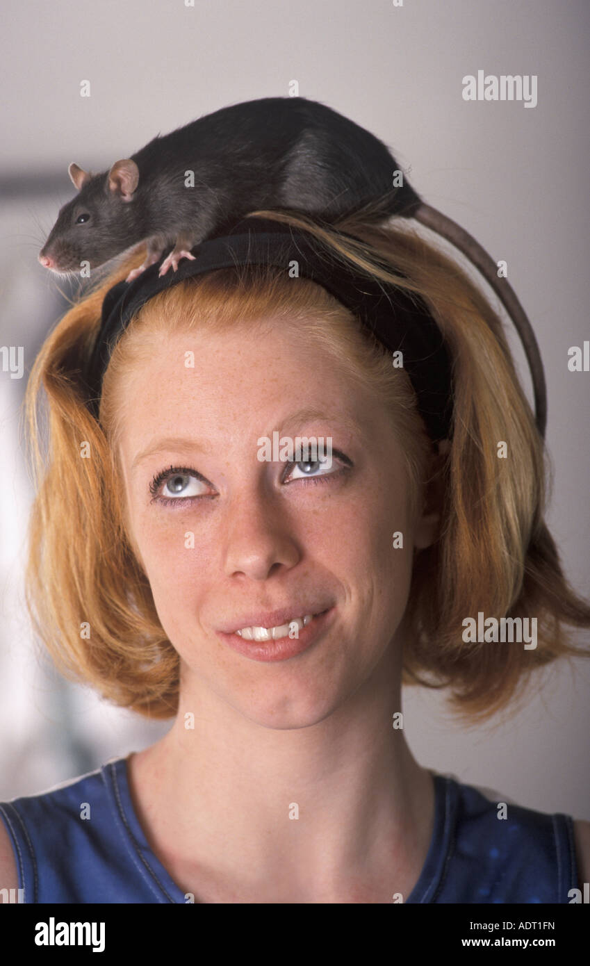 Girl with a pet rat walking on her head Stock Photo - Alamy