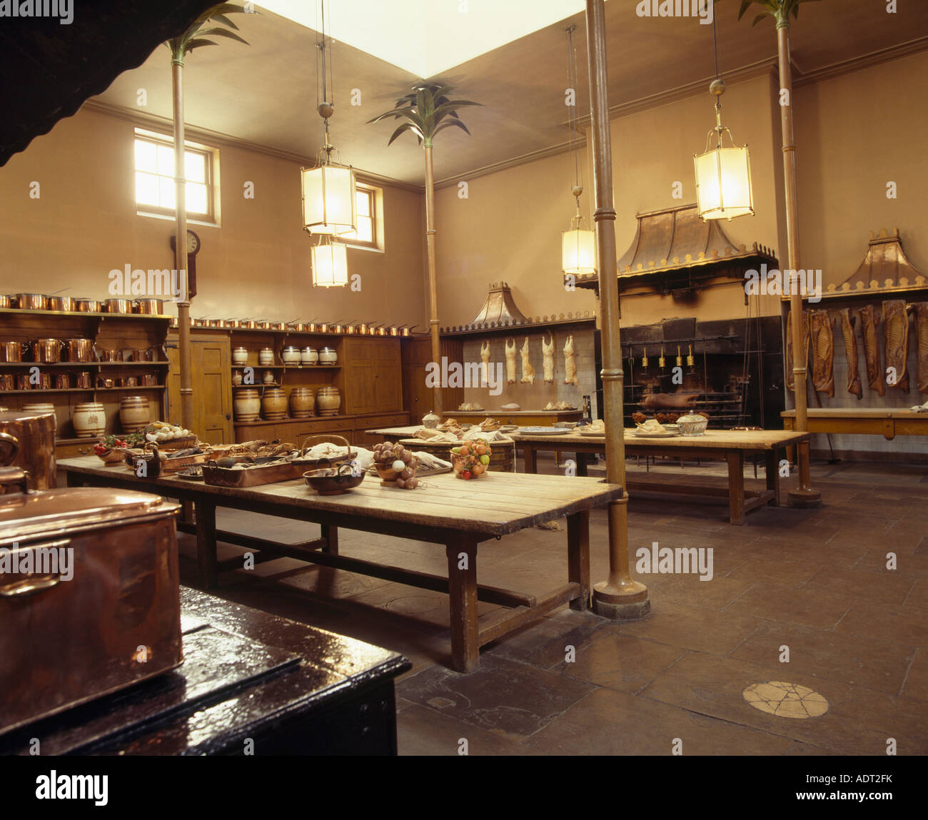 Large Edwardian kitchen with wooden tables Stock Photo - Alamy