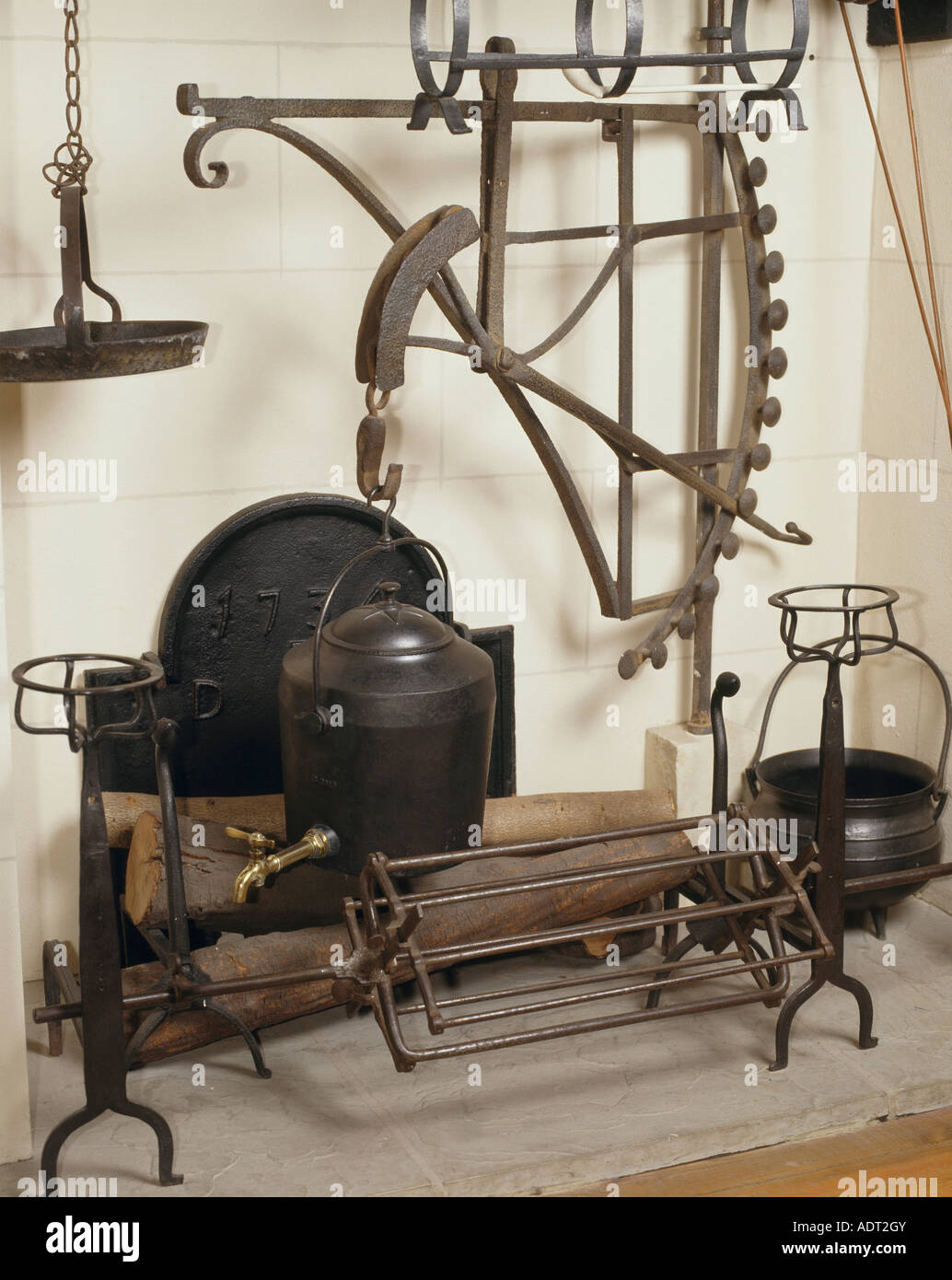 Close up of racks and cast iron kettle on pulley in Victorian kitchen ...