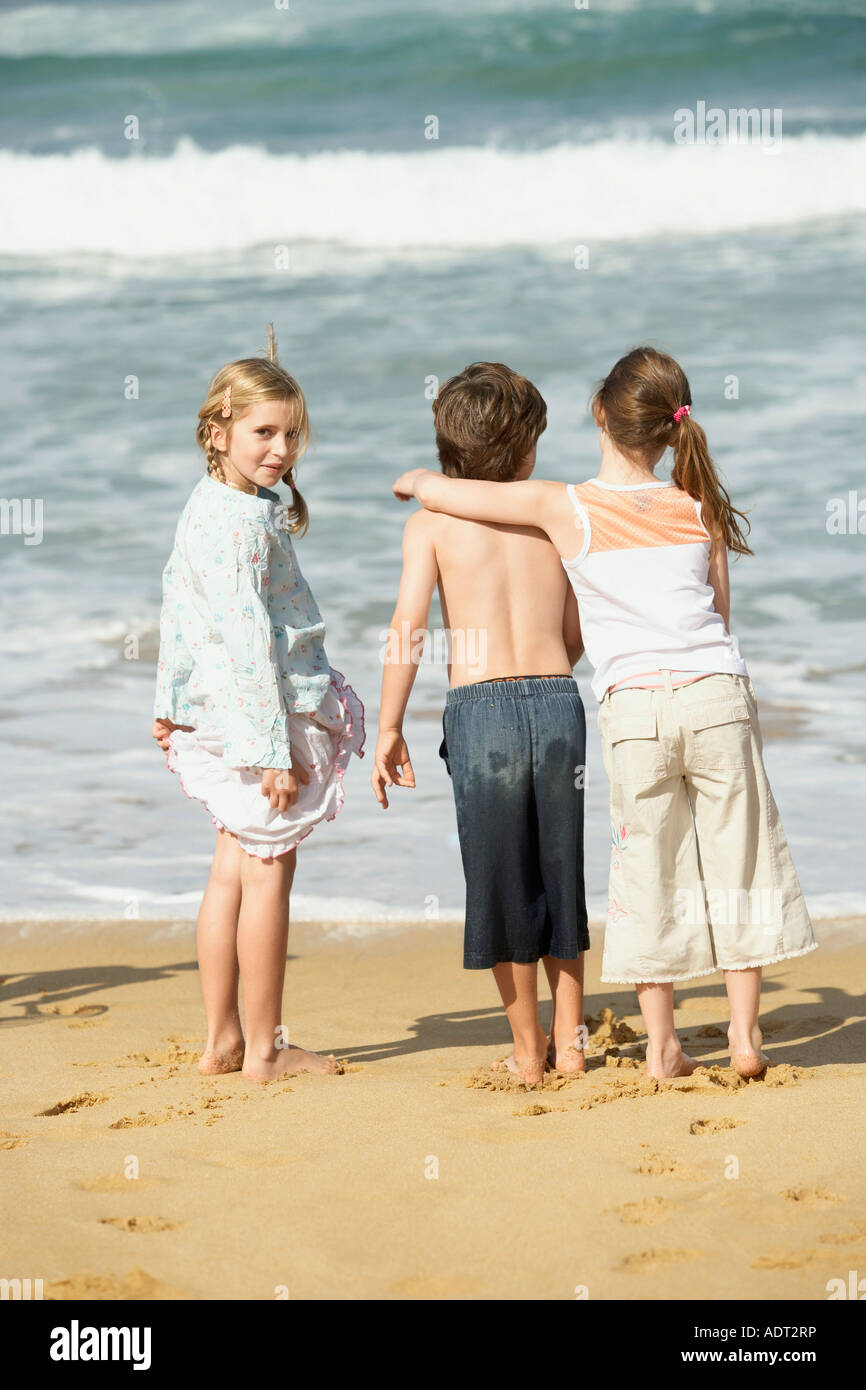 Blonde boy looking over shoulder hi-res stock photography and images ...