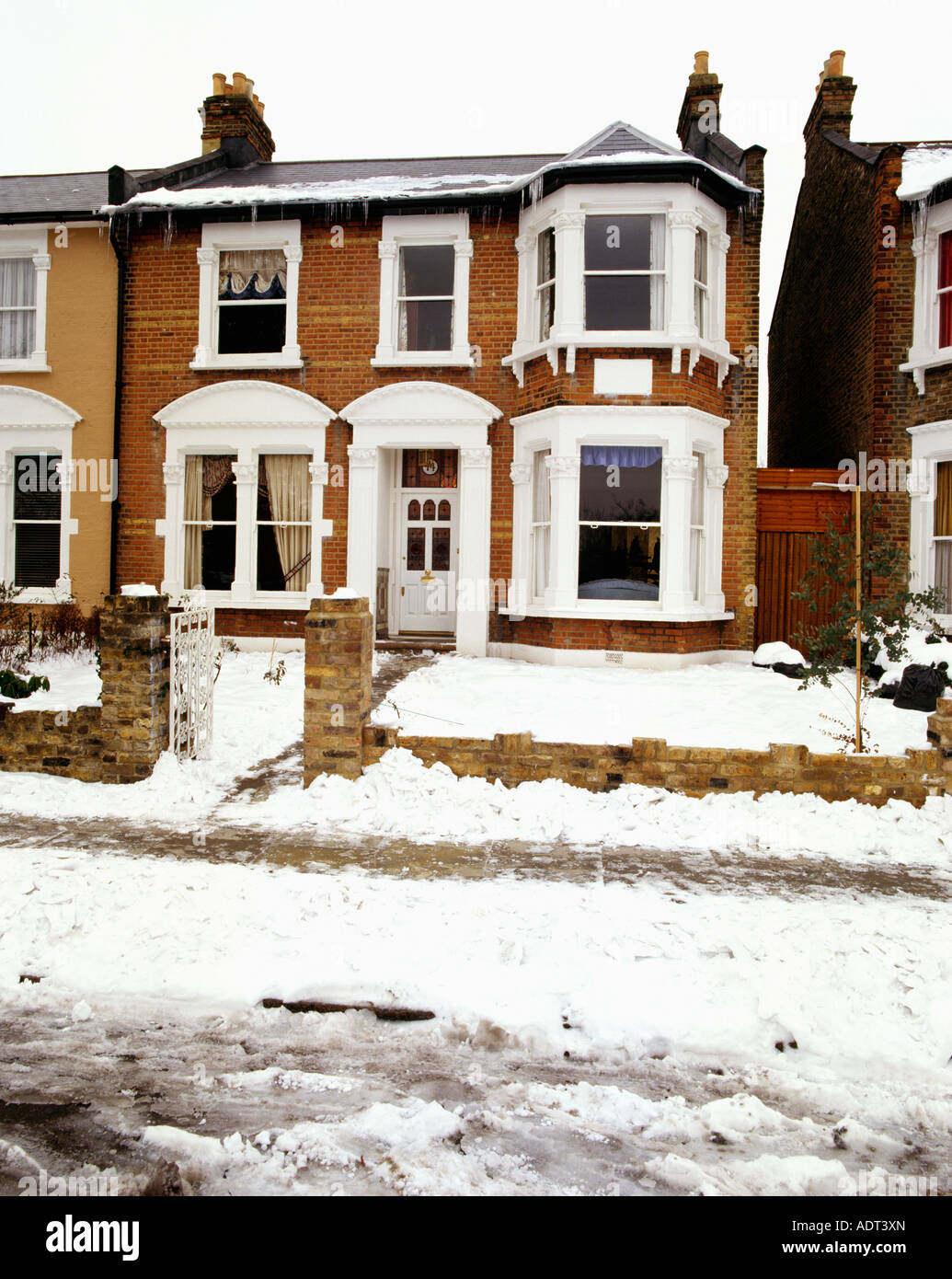 Semi detached Edwardian house in the snow Stock Photo - Alamy