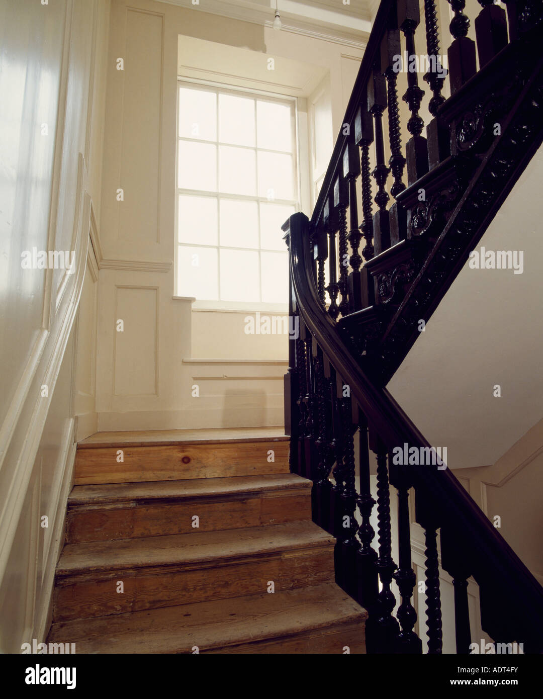 Wooden staircase with dark oak banisters in country house Stock Photo ...