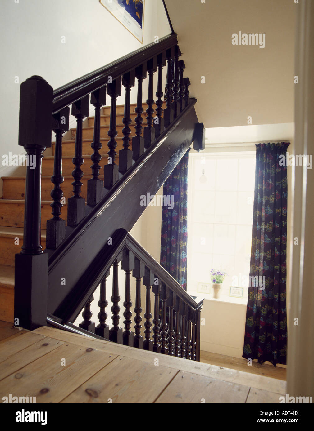 Oak banisters on large wooden staircase Stock Photo - Alamy