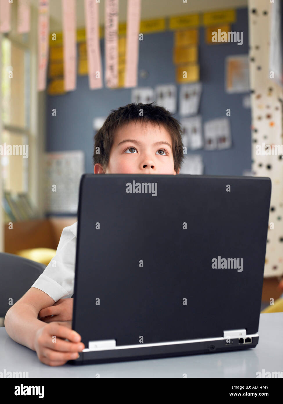 Schoolboy sitting behind hi-res stock photography and images - Alamy