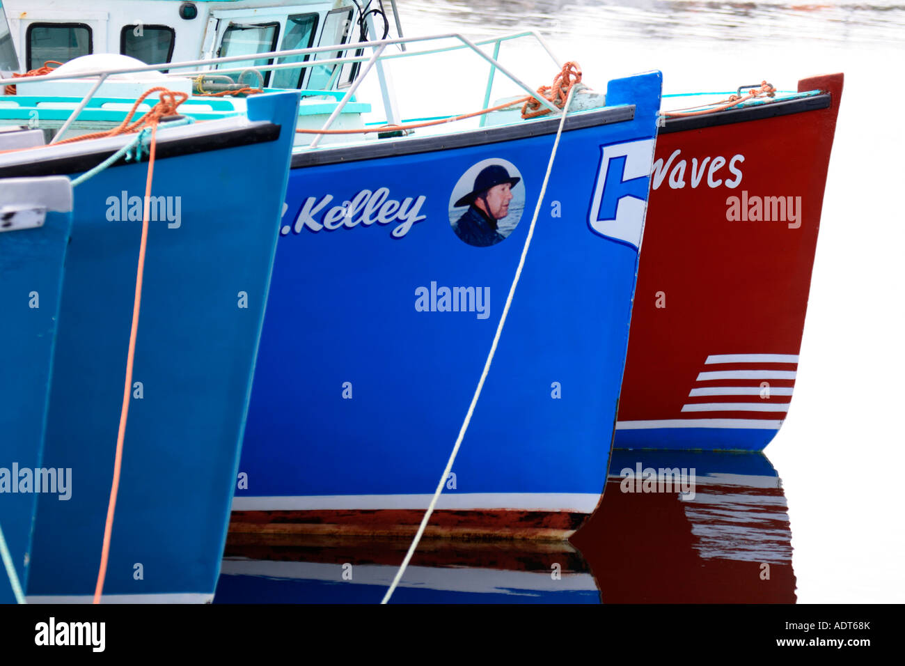 colorful prows of 3 Fishing boats at East Harbour Ingomar, Nova Scotia ...