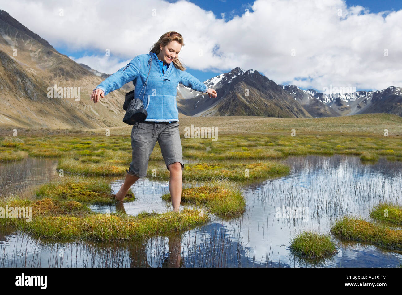 Young woman walking barefoot through hi-res stock photography and ... Young woman walking barefoot through hi-res stock photography and ...