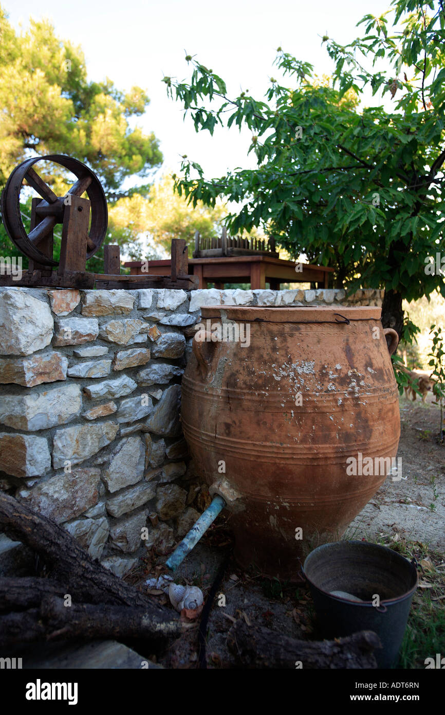 EUROPE GREECE AN OLD FASHIONED STILL FOR DISTILLING RAKI WITH A LOOM IN ...
