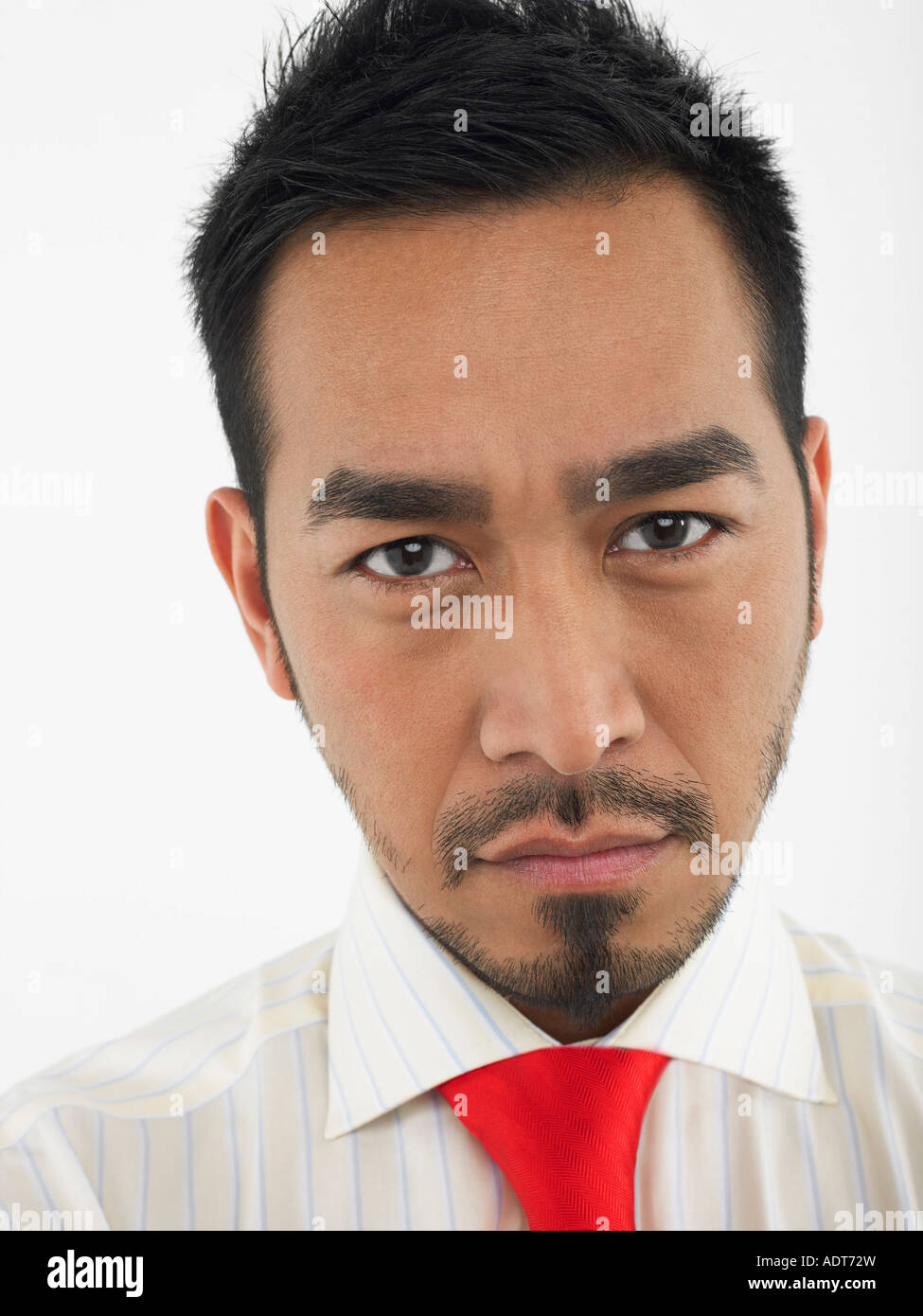 Man Frowning in studio, head and shoulders Stock Photo - Alamy