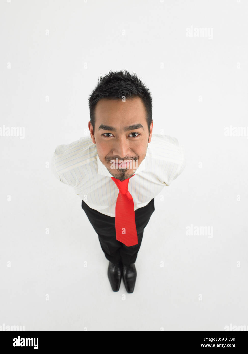 Man looking up in studio, full length, elevated view Stock Photo - Alamy