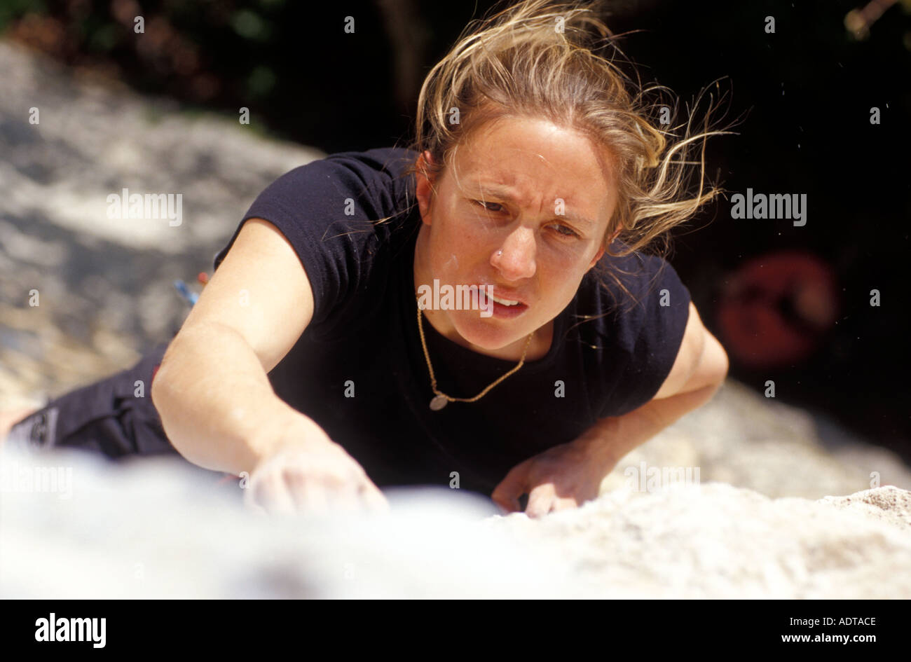 Lucy Creamer on rock face Stock Photo - Alamy