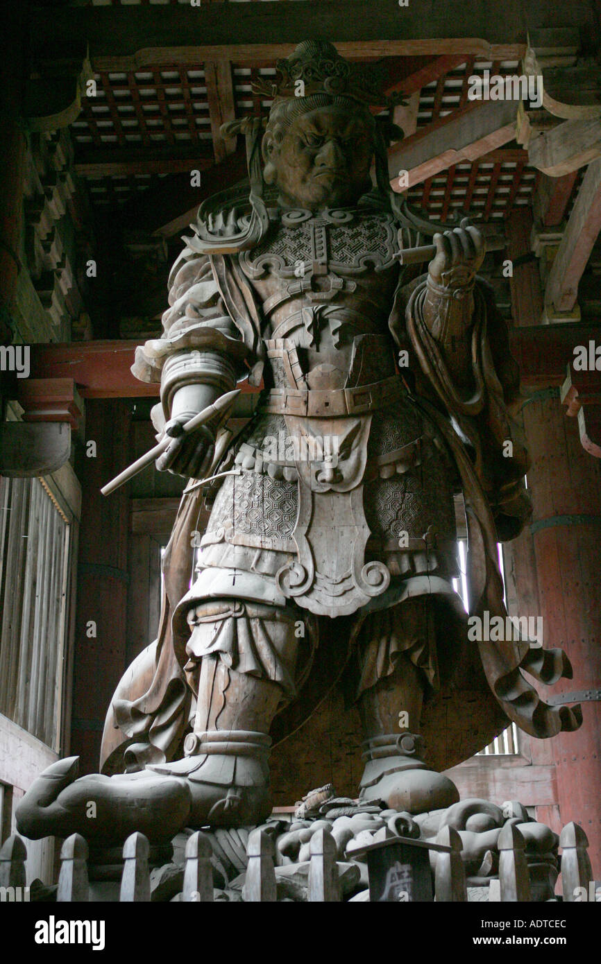 A giant wooden religious statue stands guard inside Todaiji temple a ...