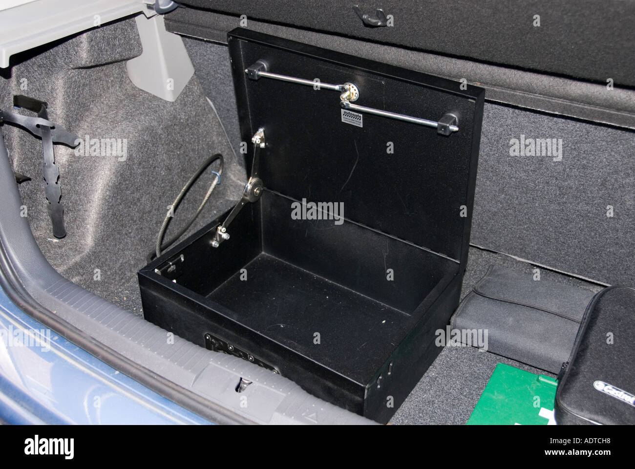 Open car boot shows strong steel security box fixed to anchor point by ...