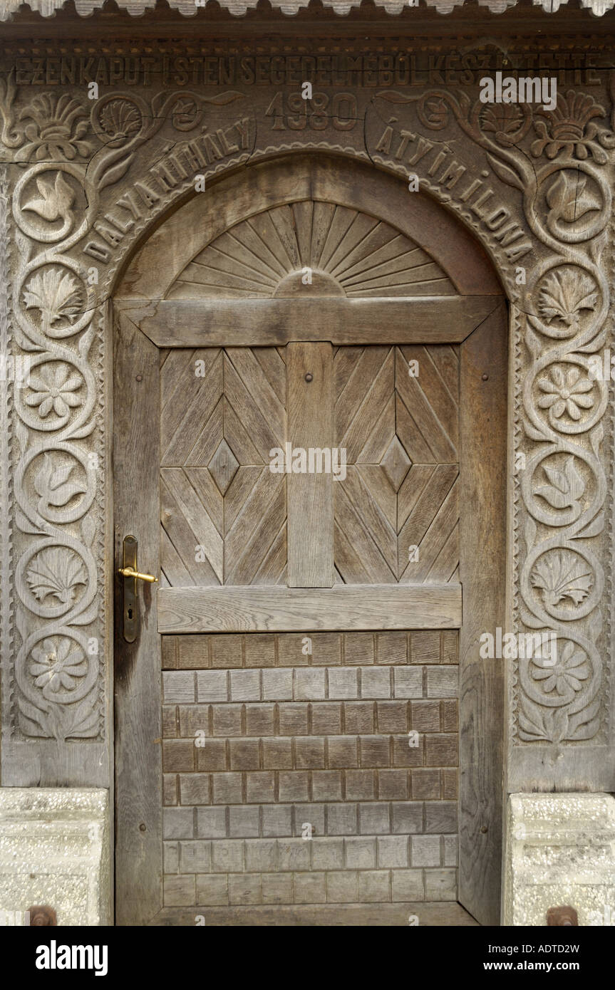 Traditional carved wooden gate, typical of the region, near Sovata ...