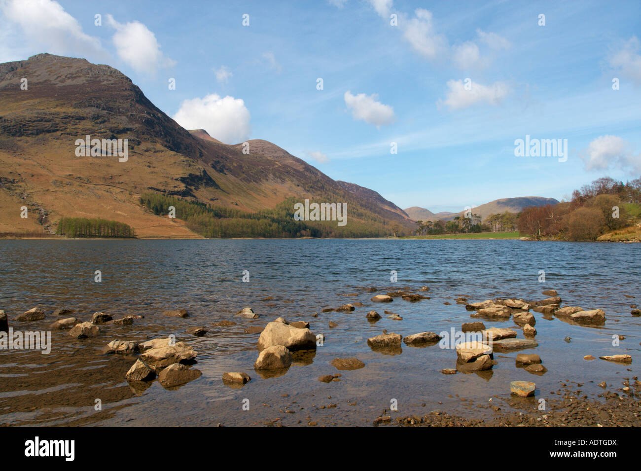 Buttermere Lake with stones in the water Cumbria UK Stock Photo - Alamy