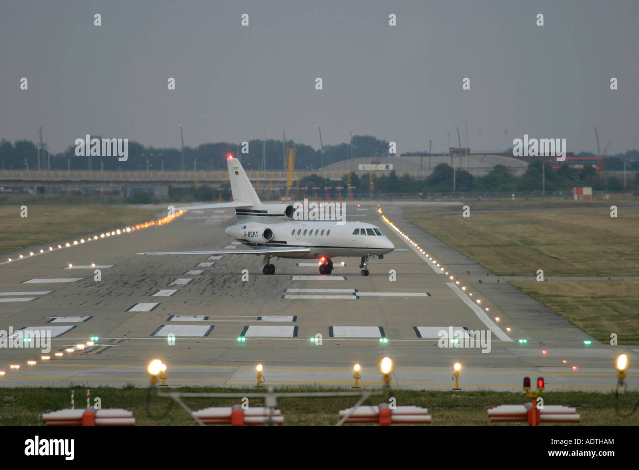 Corporate jet on runway Stock Photo - Alamy