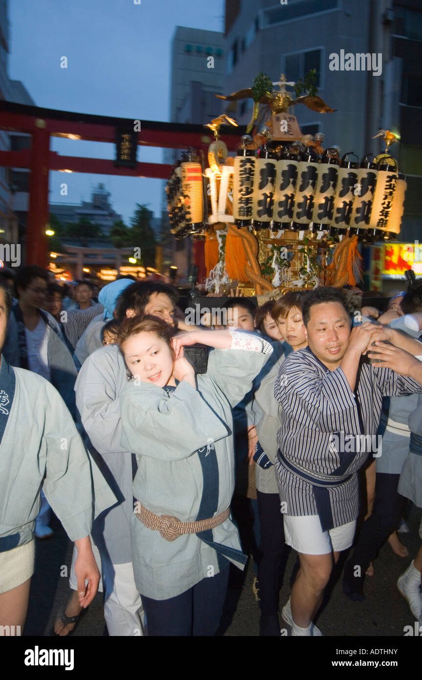 Mikoshi portable shrine parade in front of Torii gate Annual Festival ...