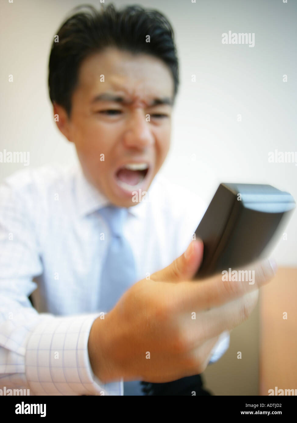Businessman screaming down telephone hi-res stock photography and ...