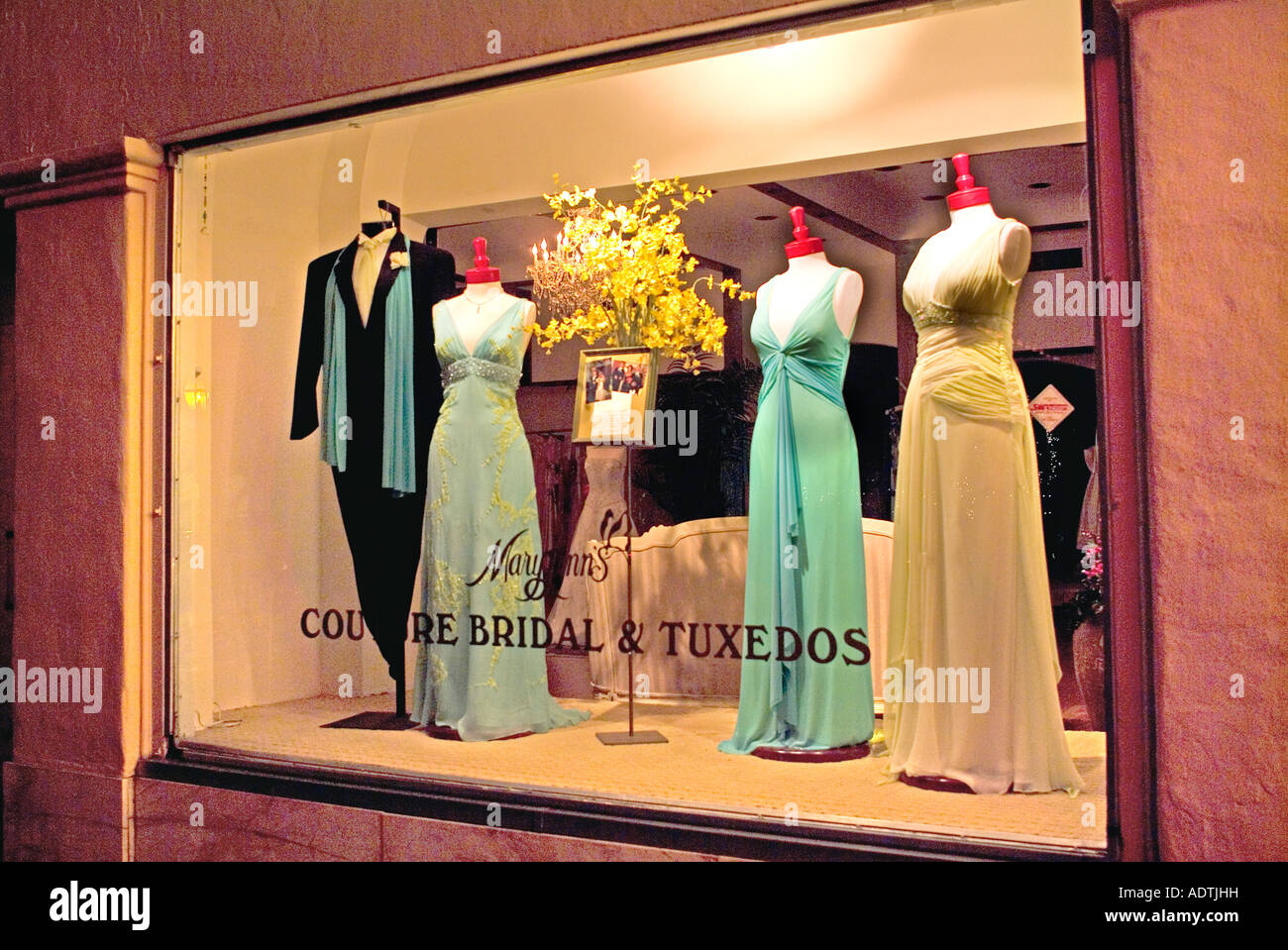 Luxurious gowns displayed in store window Stock Photo - Alamy