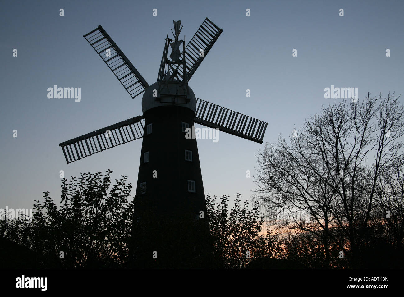 Windmill at dusk Stock Photo - Alamy