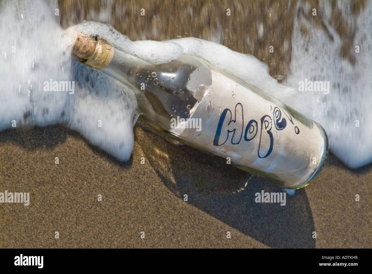 Bottle washed up on the beach with a message of hope depicting the ...